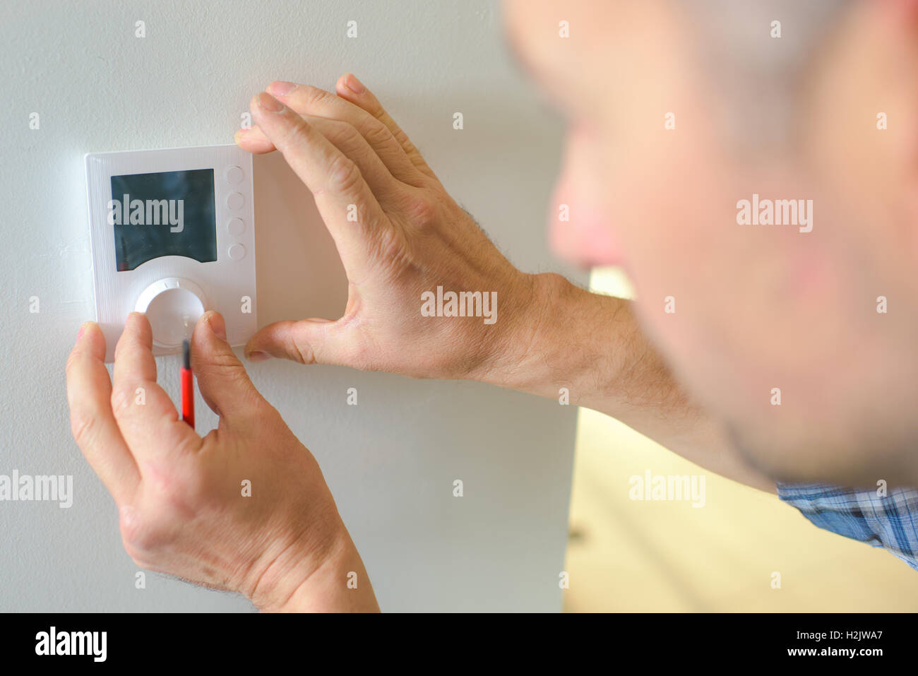 fixing the building heating problem Stock Photo - Alamy