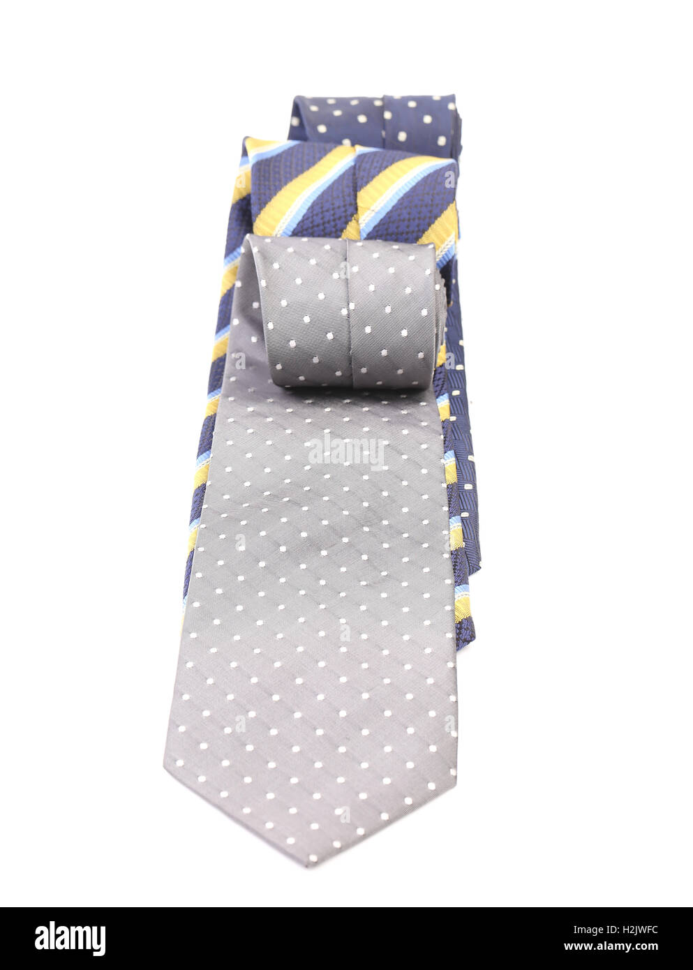 Three rolled multi-colored tie Stock Photo - Alamy