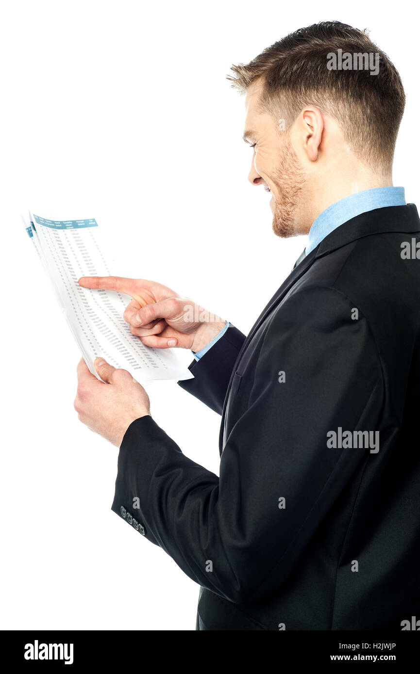 Businessman reviewing document standing hi-res stock photography and ...