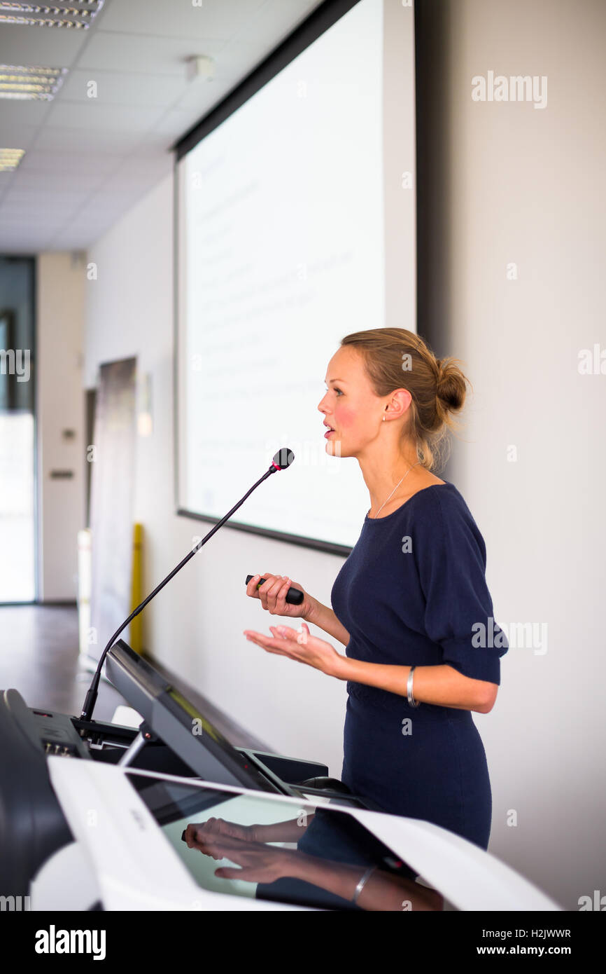 Pretty, young business woman giving a presentation Stock Photo - Alamy