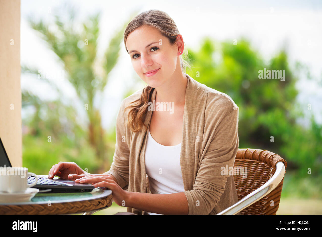 Portrait of a pretty young woman working on her computer Stock Photo ...