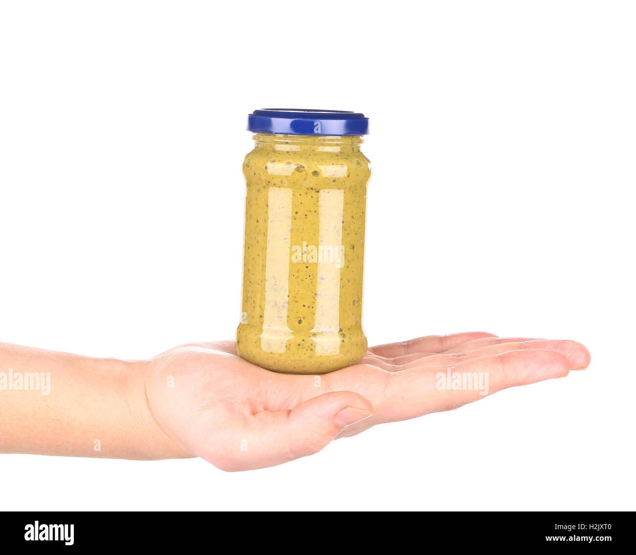 Hand holds italian sauce Pesto Stock Photo - Alamy