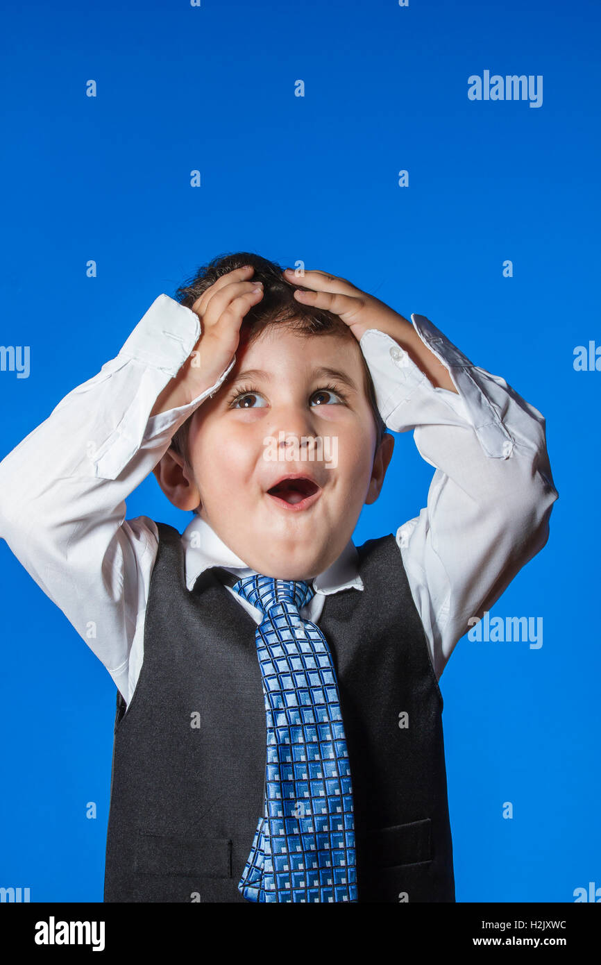 Leader, cute little boy portrait over blue chroma background Stock ...