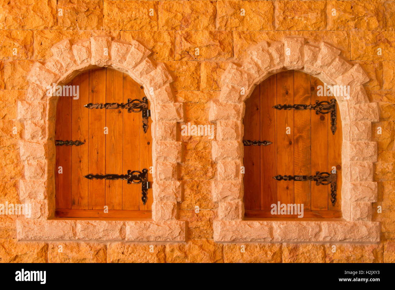 Two windows with shutters on medieval styled house Stock Photo - Alamy