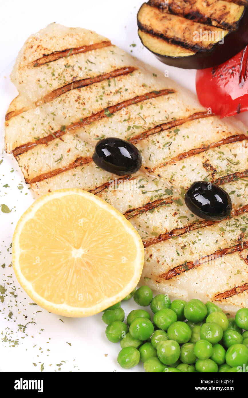 Pangasius fillet grilled with vegetables Stock Photo - Alamy