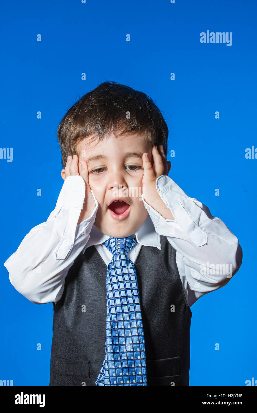 Leader, cute little boy portrait over blue chroma background Stock ...