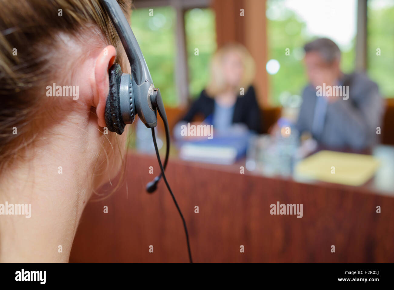 Closeup of woman wearing headset in conference room Stock Photo - Alamy