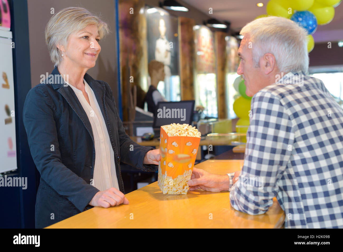 Ordering popcorn hi-res stock photography and images - Alamy