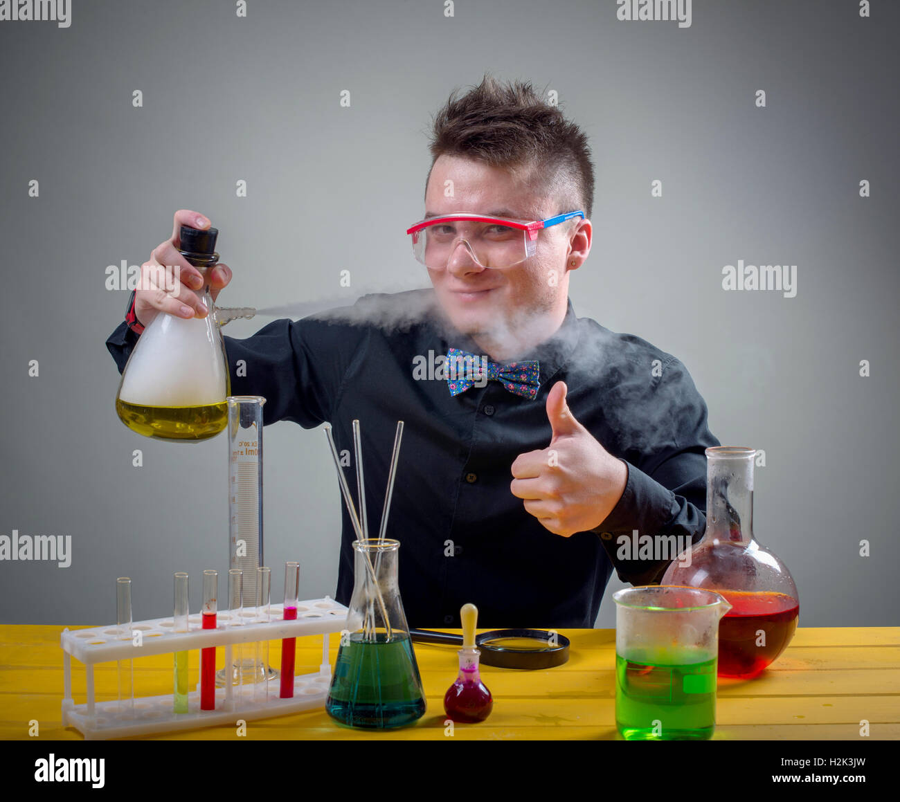 magician in chemical laboratory prepares magical solution Stock Photo ...