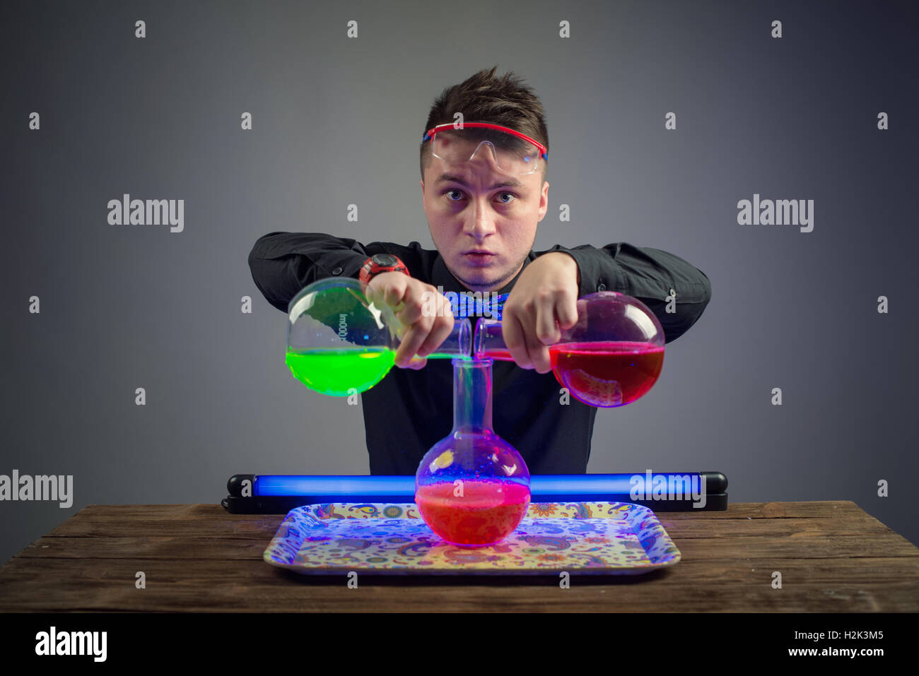 magician in chemical laboratory prepares magical solution Stock Photo ...