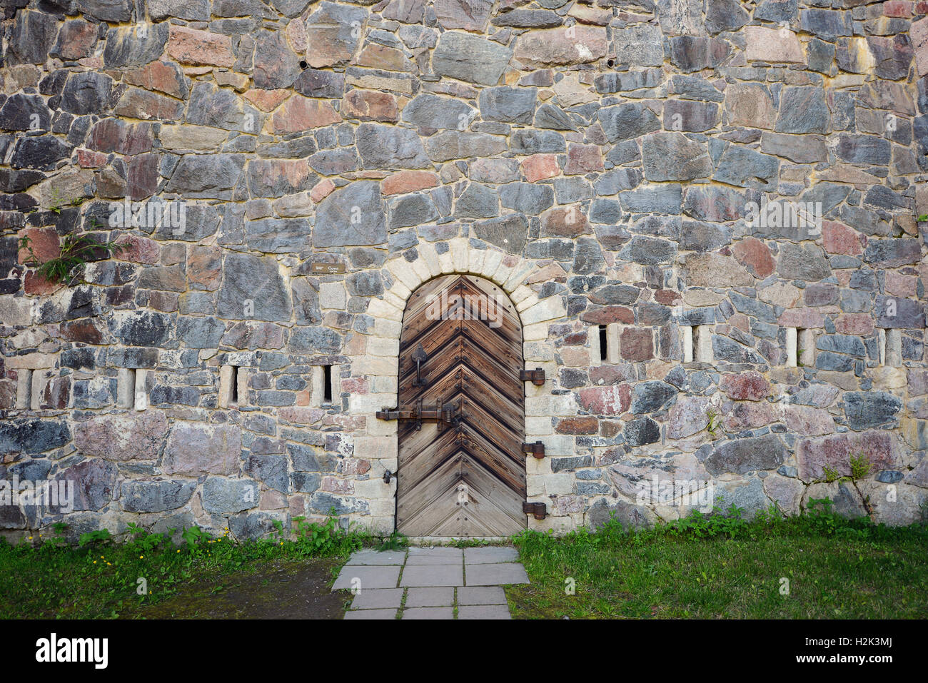 stone wall with door Stock Photo - Alamy