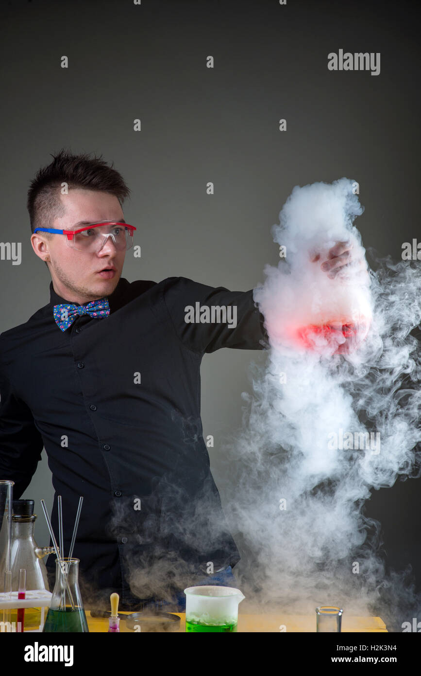 magician in chemical laboratory prepares magical solution Stock Photo ...