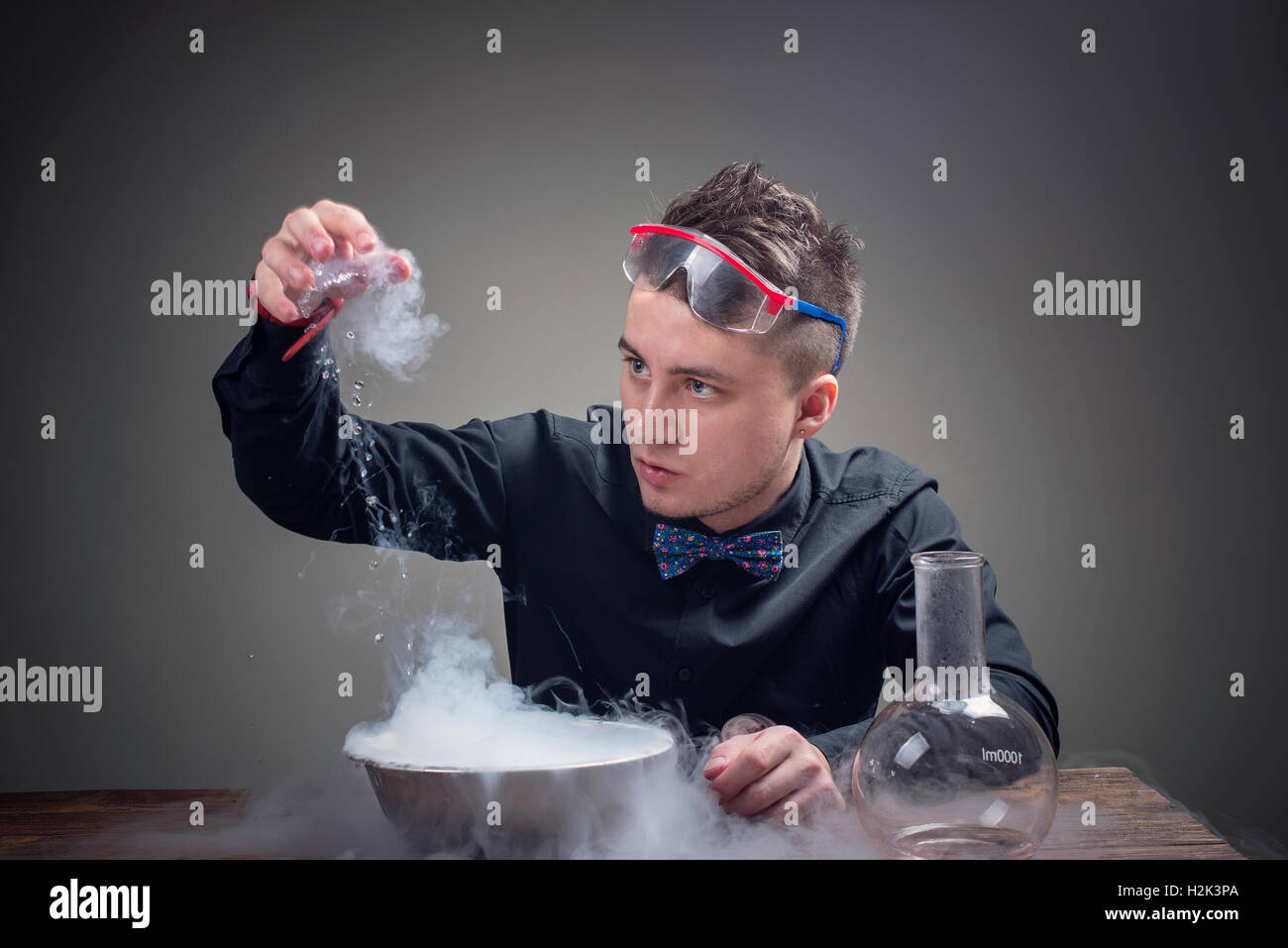 magician in chemical laboratory prepares magical solution Stock Photo ...