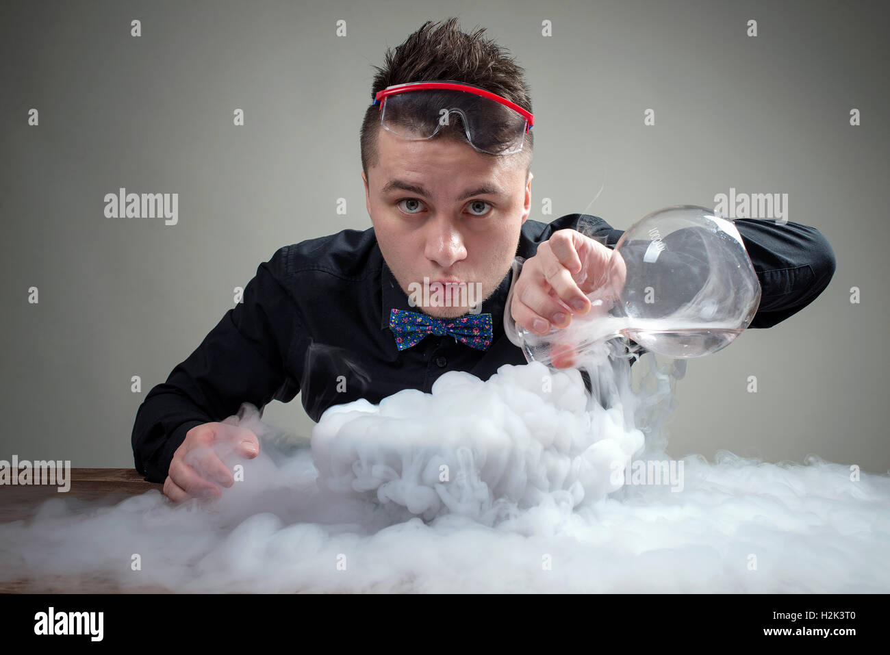 magician in chemical laboratory prepares magical solution Stock Photo ...