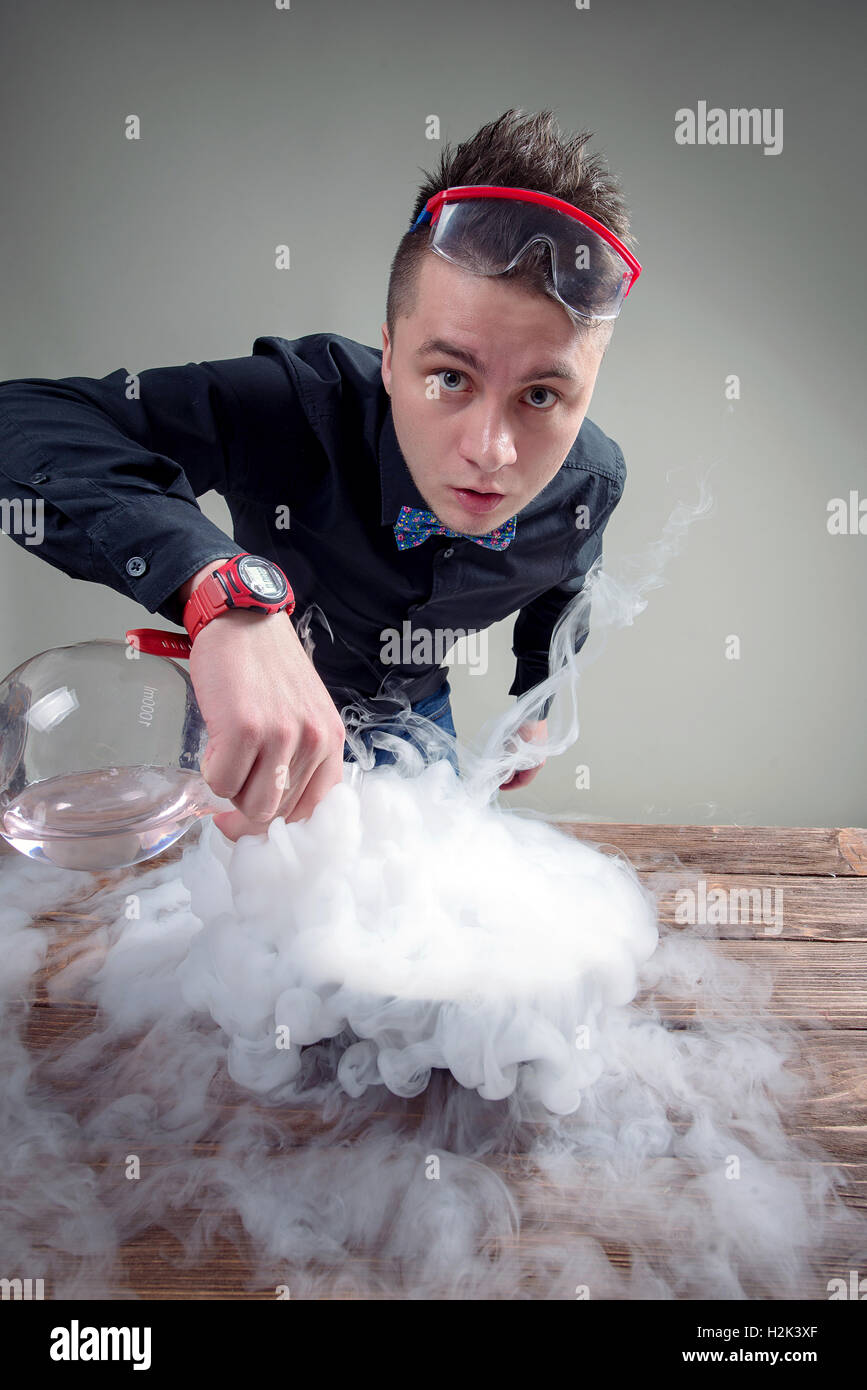 magician in chemical laboratory prepares magical solution Stock Photo ...