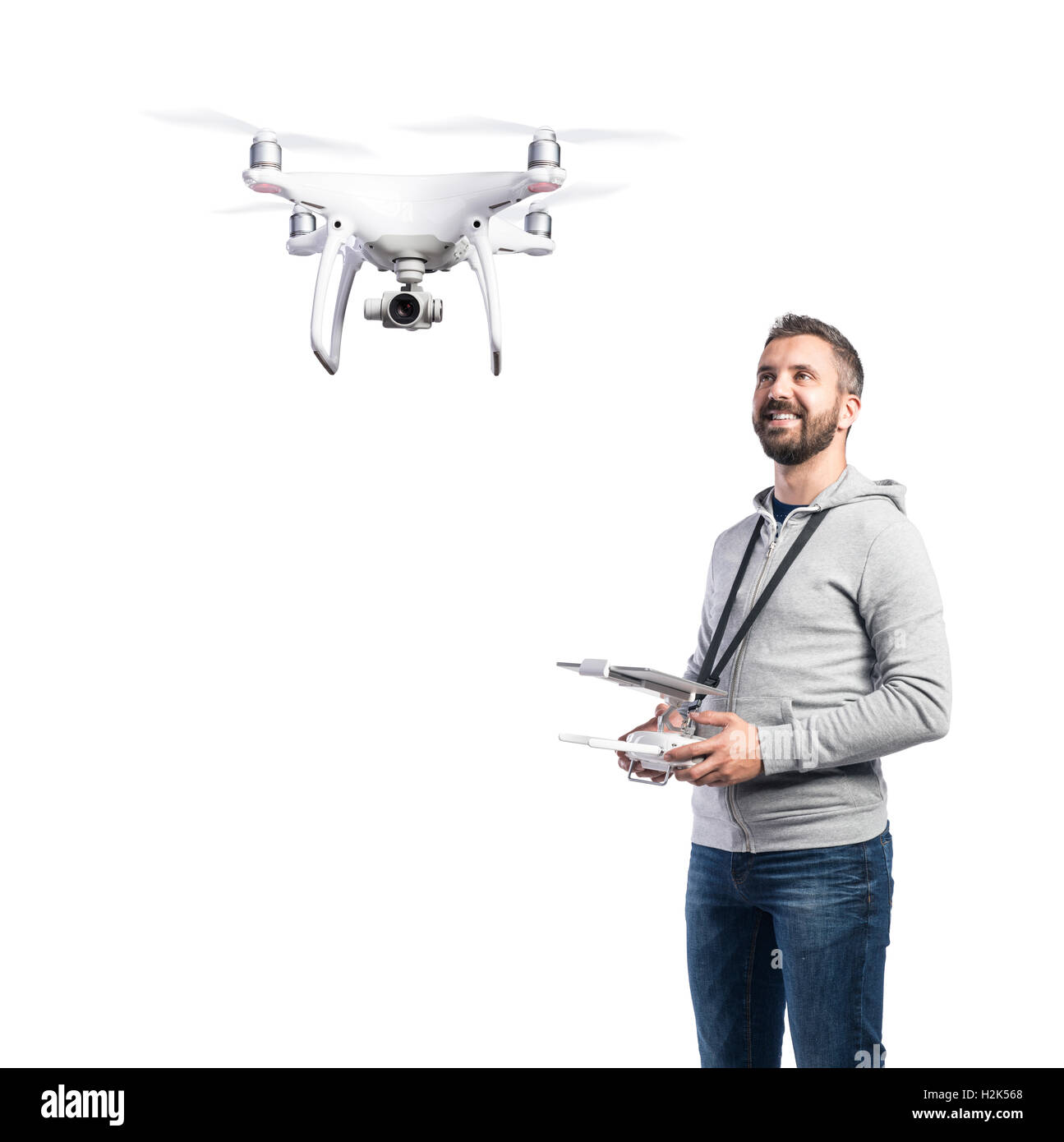 Man with flying drone. Studio shot on white background, isolated Stock ...