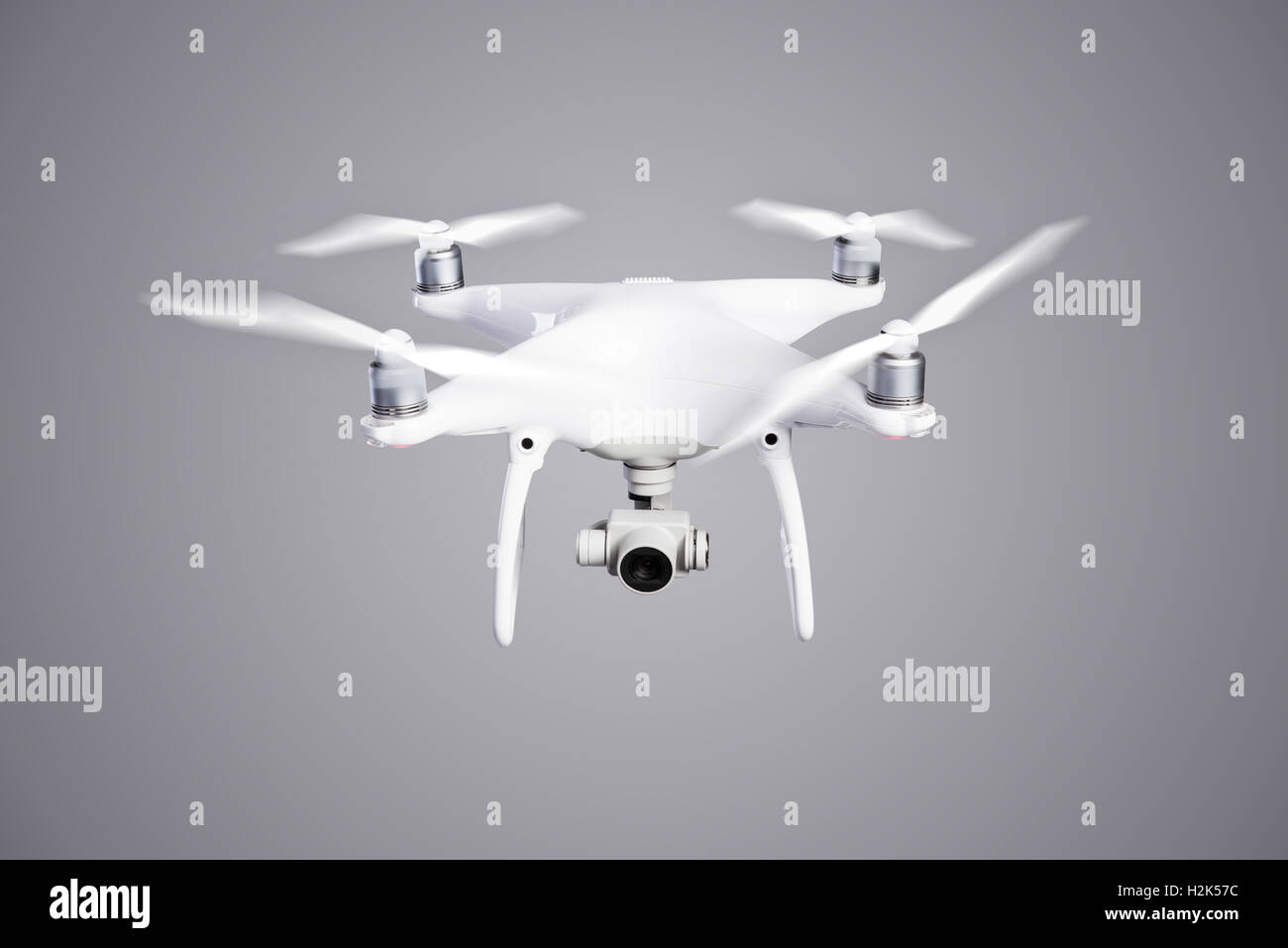 Flying helicopter drone with camera. Studio shot Stock Photo - Alamy