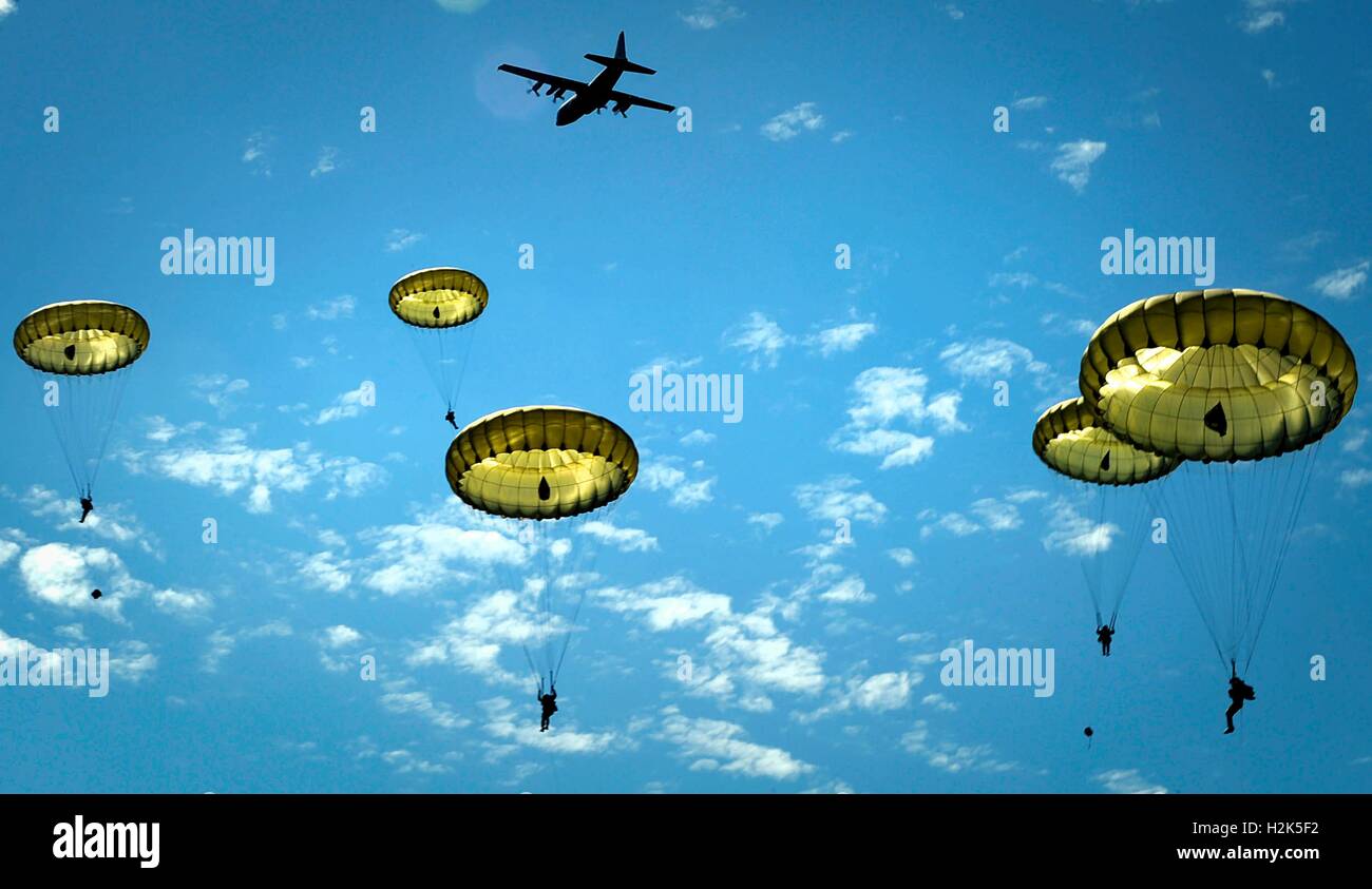 Paratroopers jump onto the Iron Mike drop zone during the 70th ...