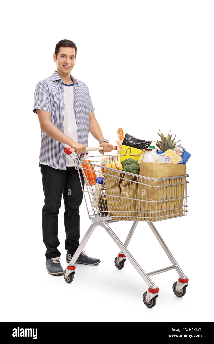Full length portrait of a man posing with a shopping cart and looking ...