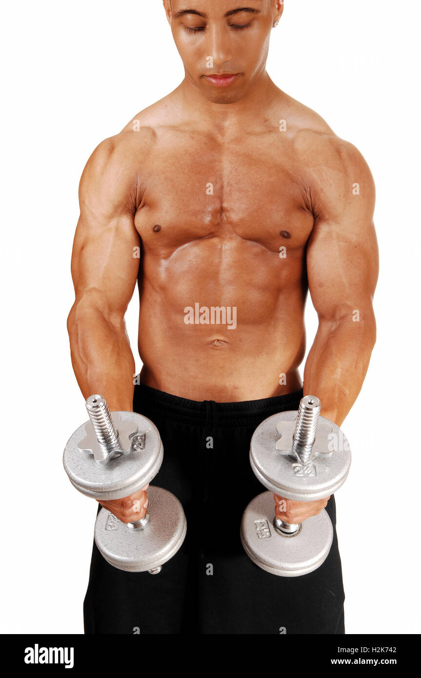 A picture from the front of a young bodybuilder in black shorts lifting ...