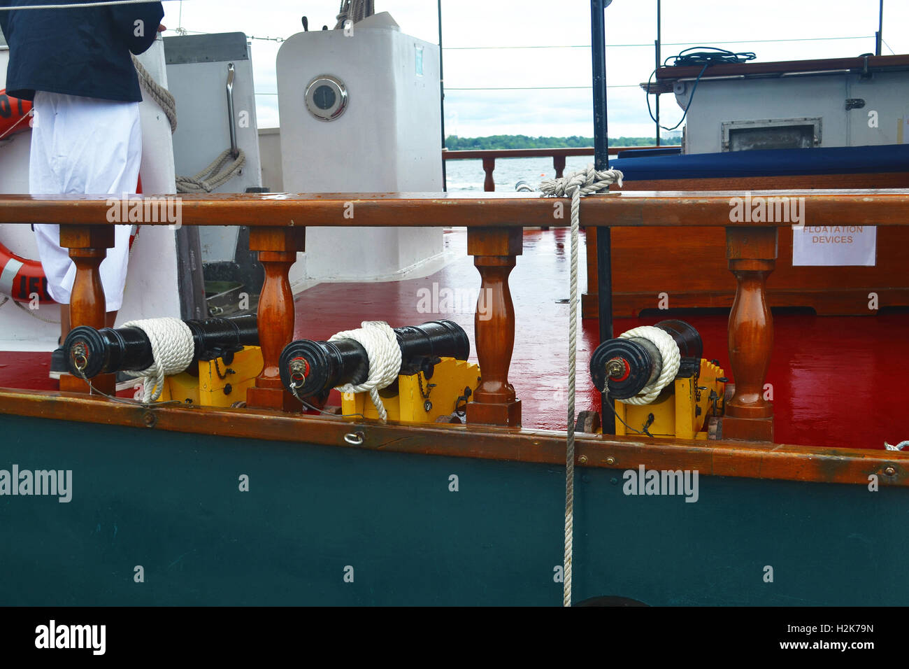 Three small cannons on a tall a tall ship in the harbour Stock Photo ...