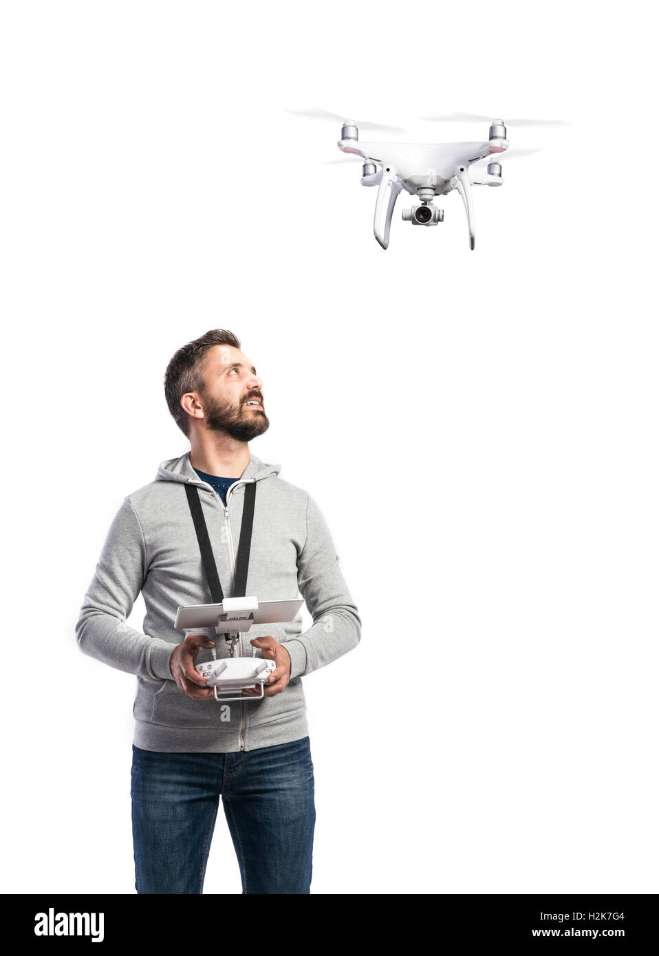 Man with flying drone. Studio shot on white background, isolated Stock ...