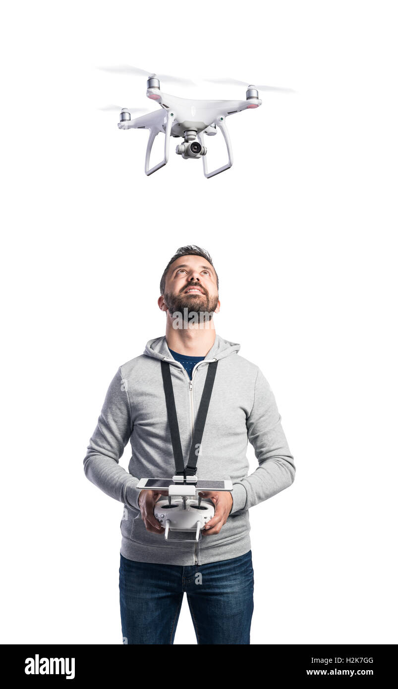 Man with flying drone. Studio shot on white background, isolated Stock ...