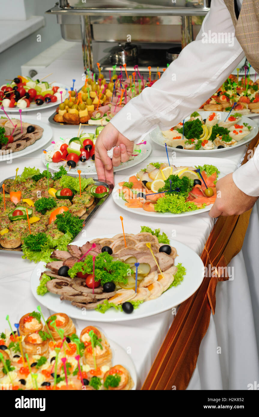 banquet table served with canape Stock Photo - Alamy
