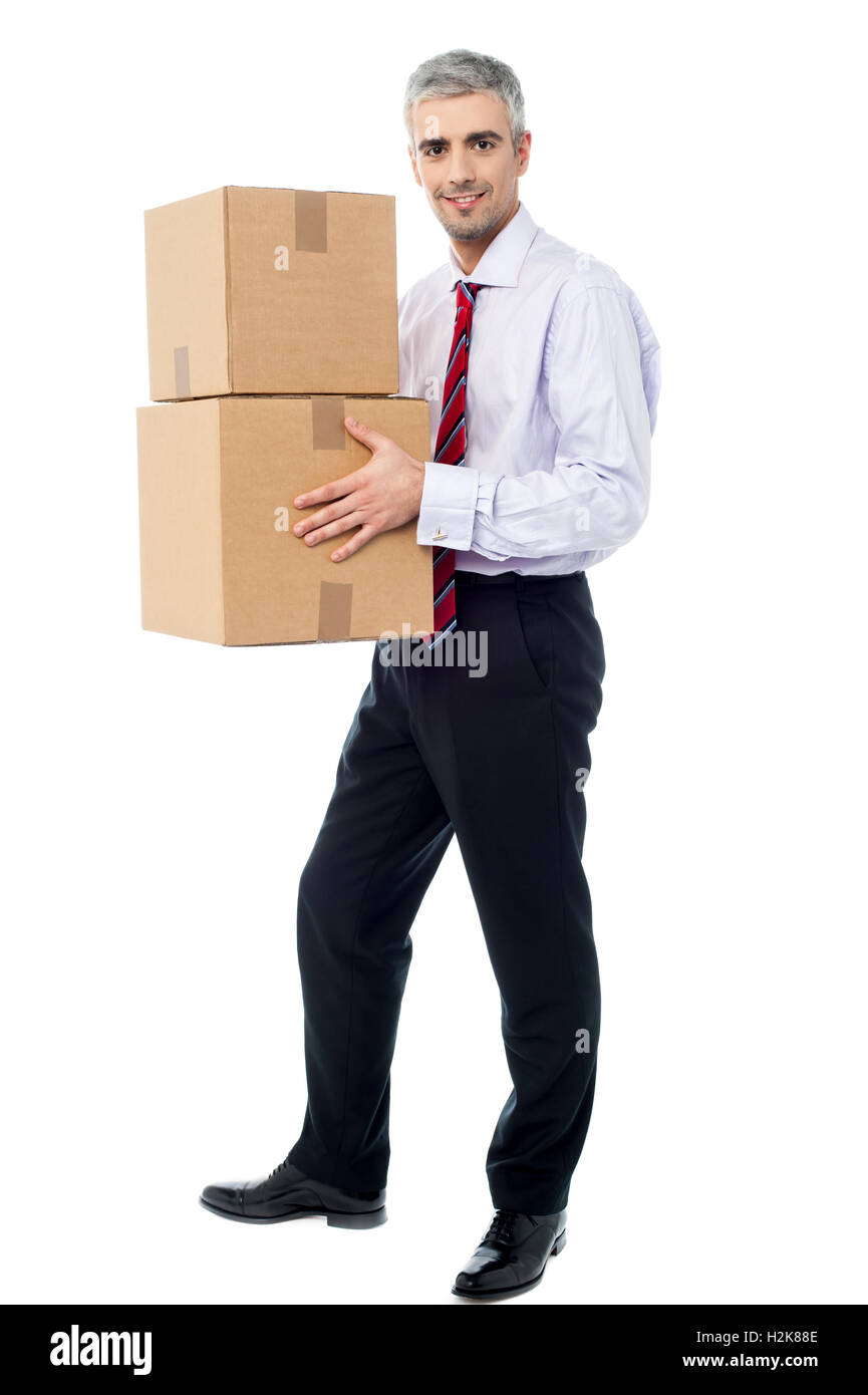 Corporate man holding stack of parcel boxes Stock Photo - Alamy
