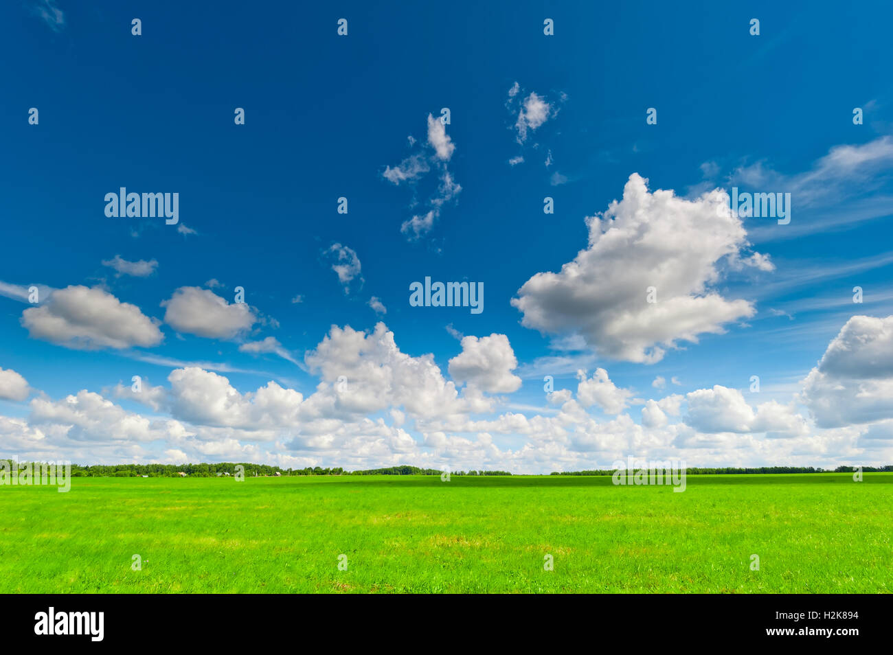 beautiful clouds cast shadows on the green field Stock Photo - Alamy