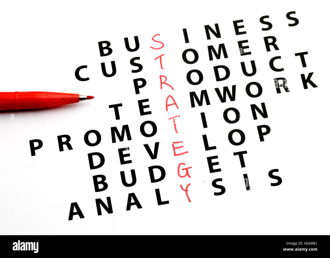 Hand writing strategy concept by crossword Stock Photo - Alamy