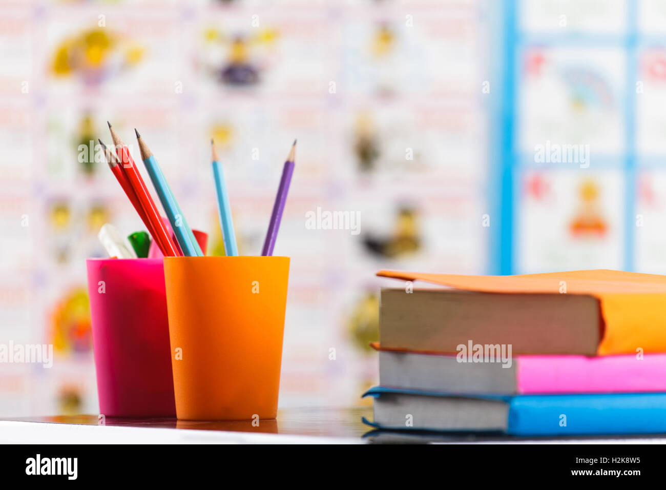 Pencils and book Stock Photo - Alamy