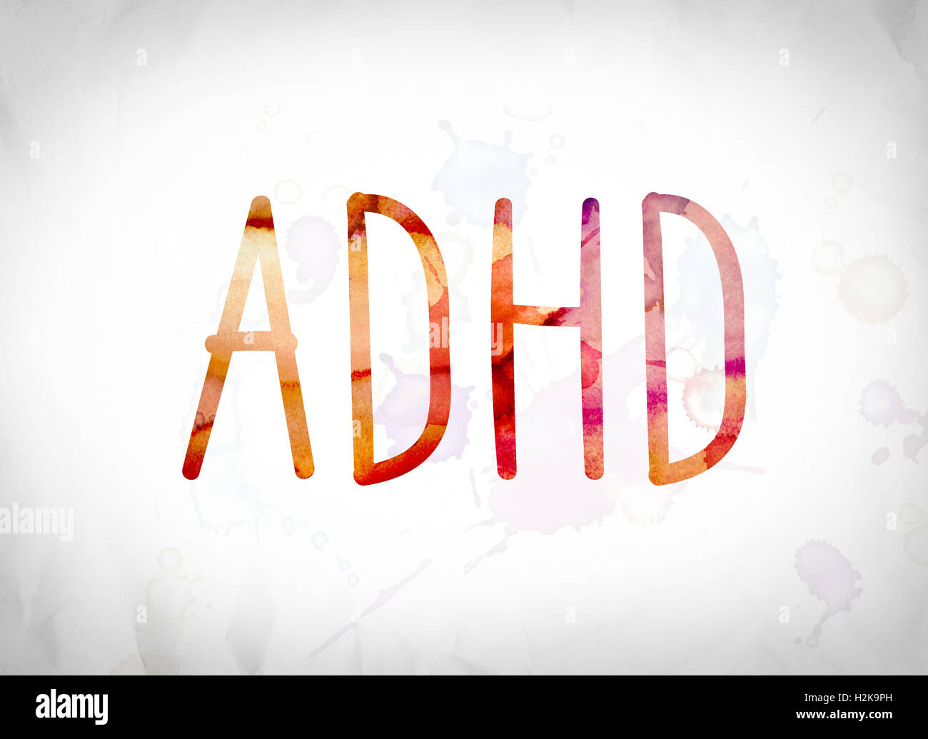 The word "ADHD" written in watercolor washes over a white paper ...