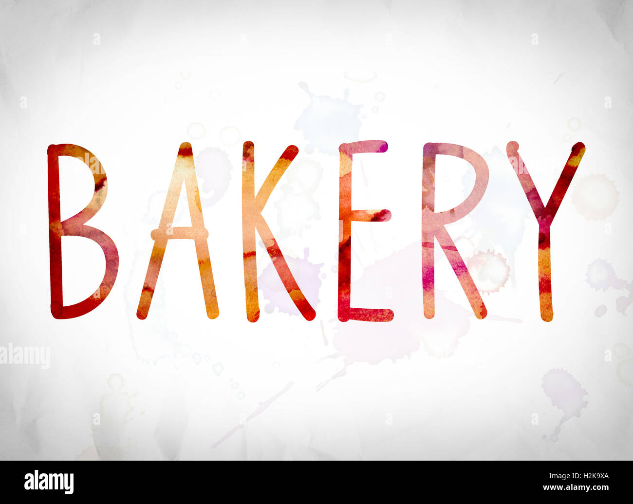 The word "Bakery" written in watercolor washes over a white paper ...