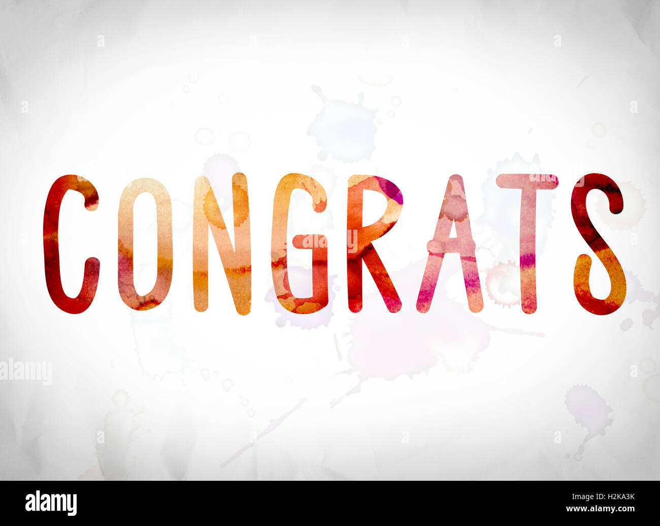 The word "Congrats" written in watercolor washes over a white paper ...