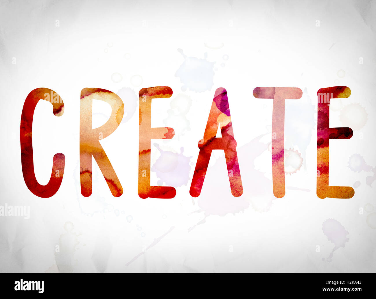 The word "Create" written in watercolor washes over a white paper ...