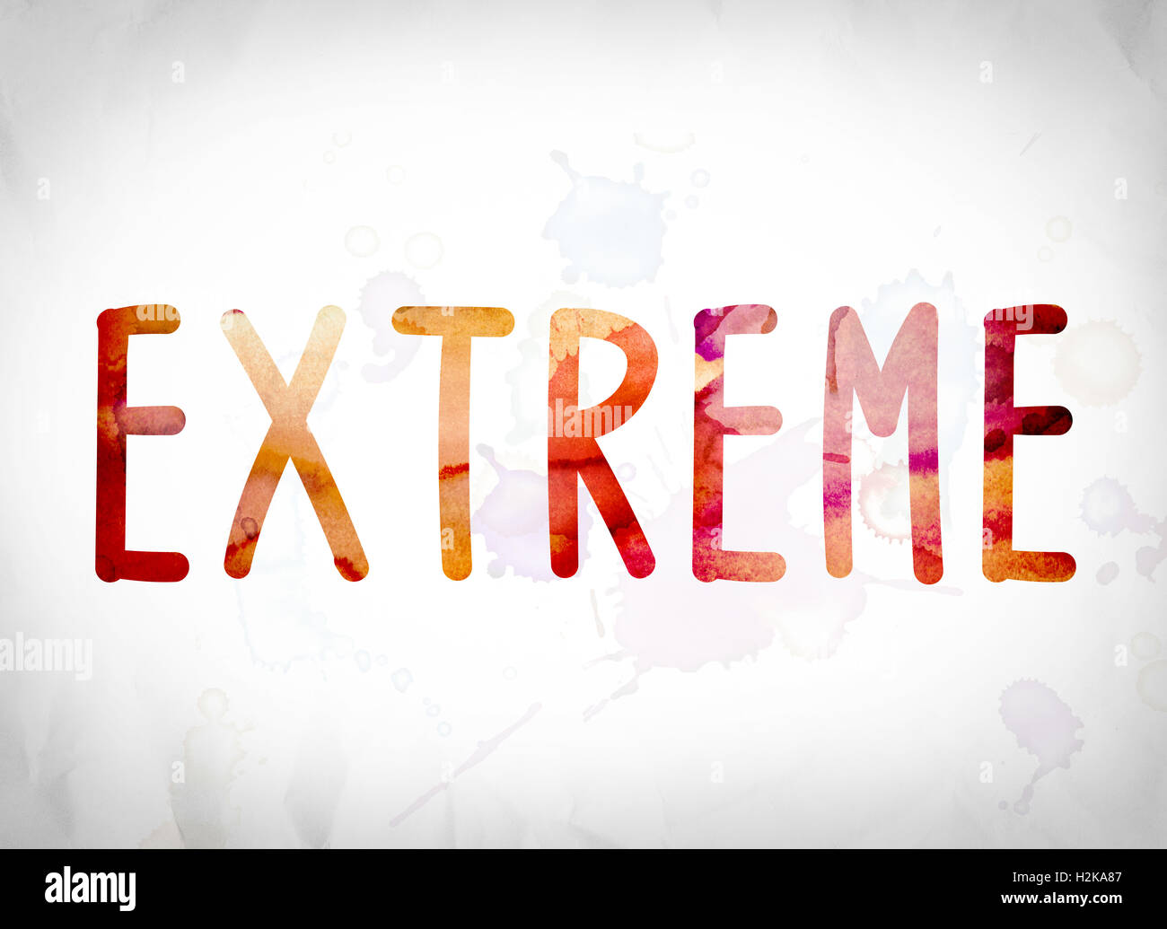 The word "Extreme" written in watercolor washes over a white paper ...