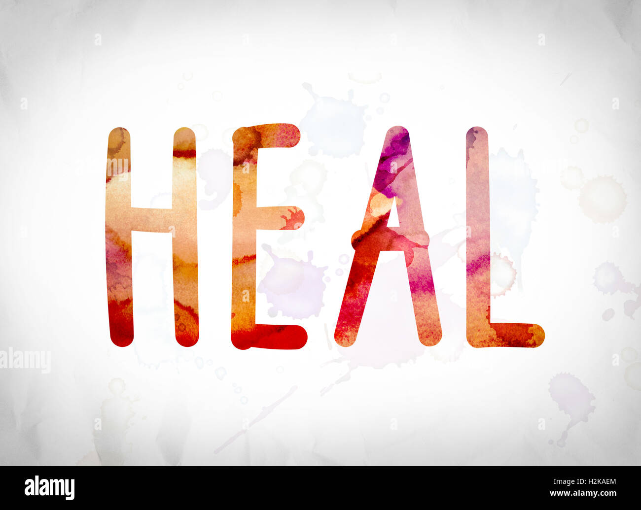 The word "Heal" written in watercolor washes over a white paper ...