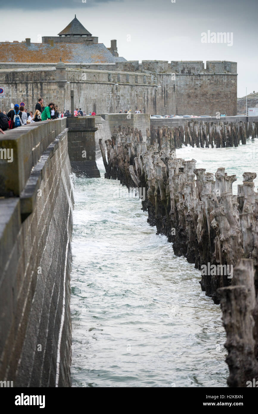 Atlantic beach under the towers of city walls in St Malo in English ...