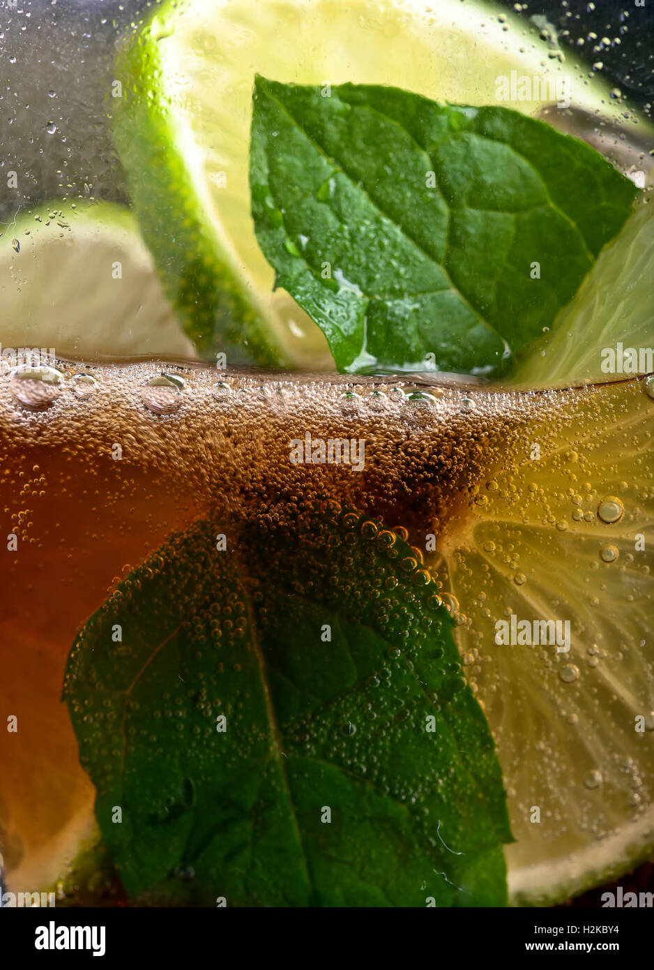 cola with lime , ice and peppermint leaves Stock Photo - Alamy