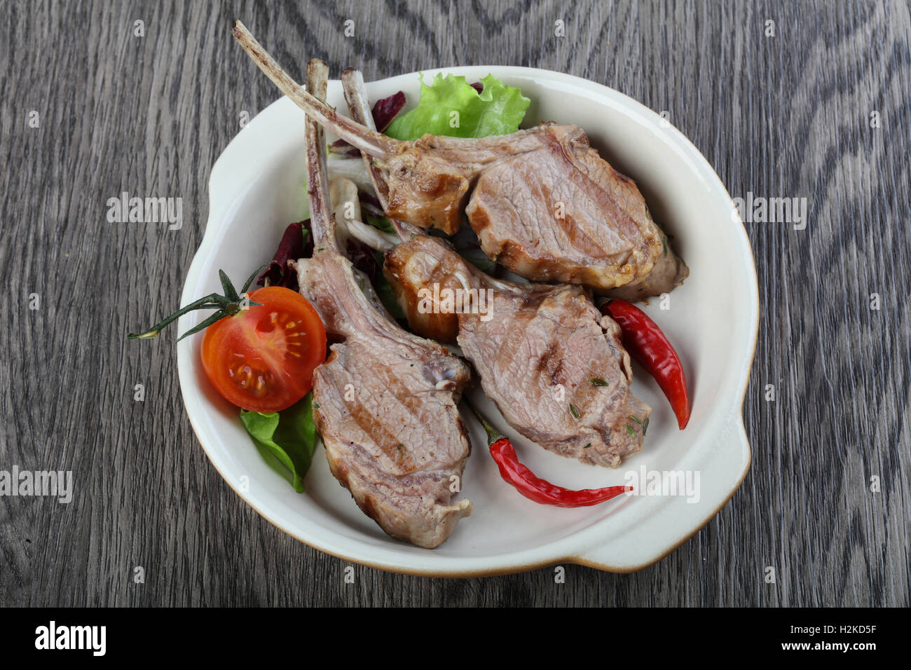 Lamb Frenched Rack grilled rib bone Stock Photo - Alamy
