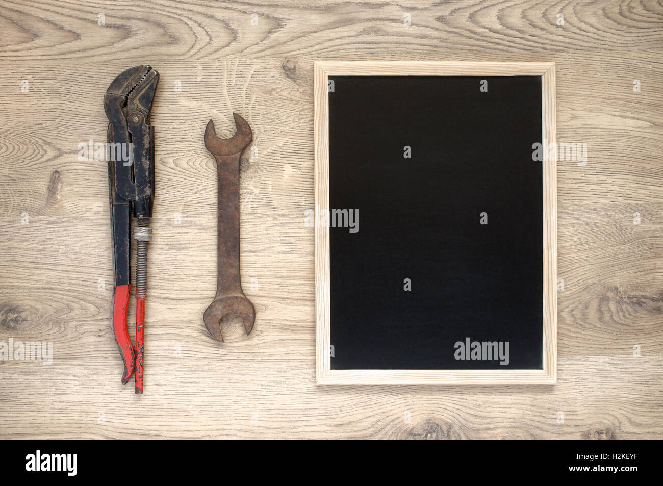 Rusty old hand tools with empty blackboard Stock Photo - Alamy