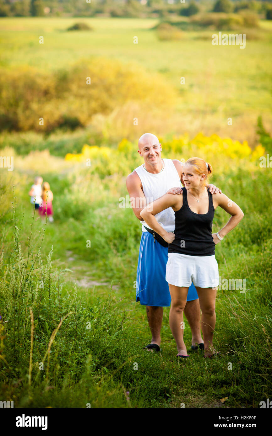 Family having fun in a park during beautiful summer evening Stock Photo ...