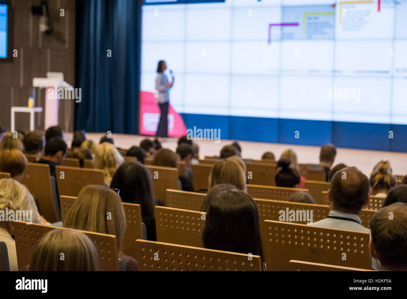 Audience listening a lecture Stock Photo - Alamy