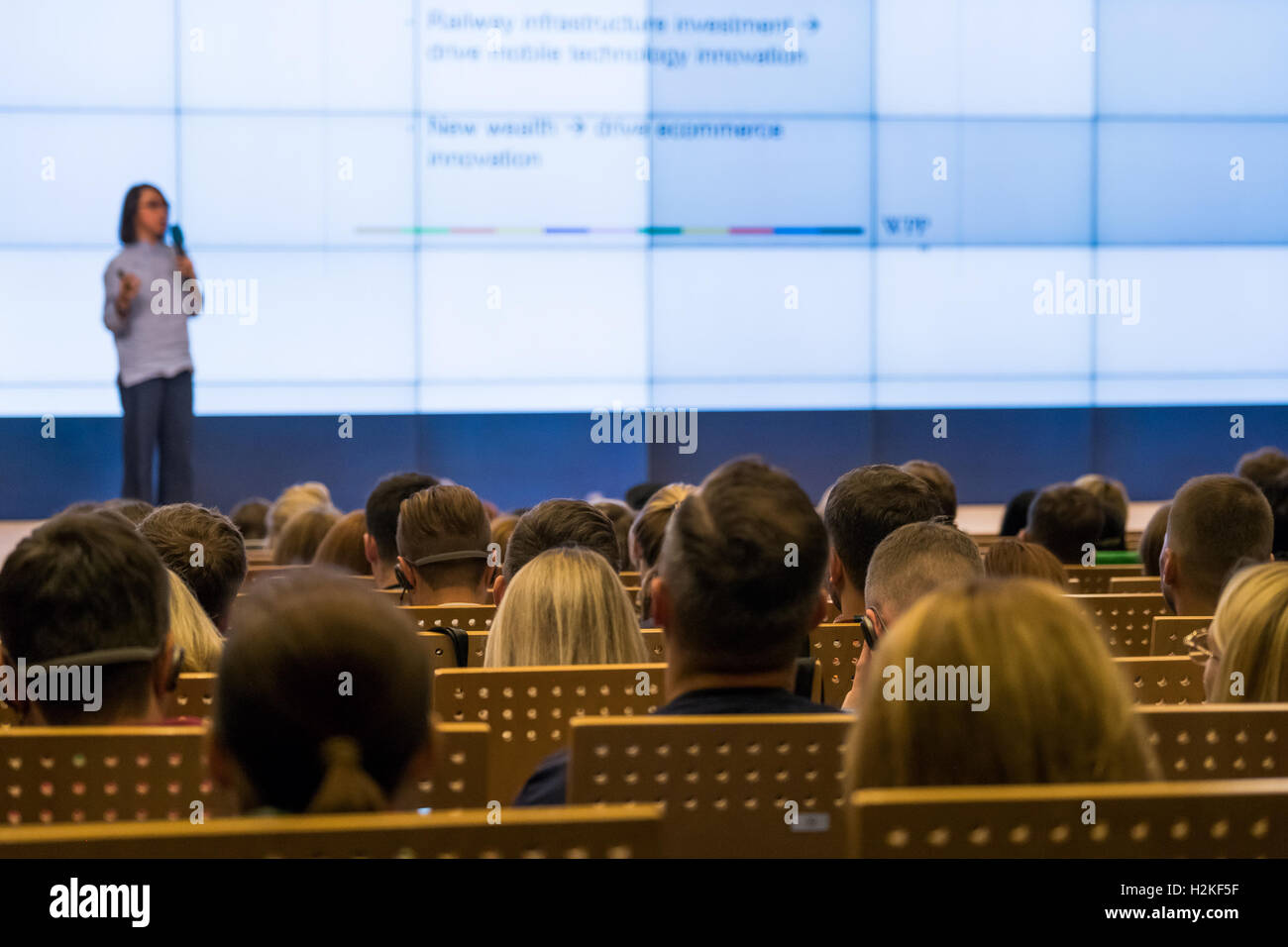 Audience listening a lecture Stock Photo - Alamy