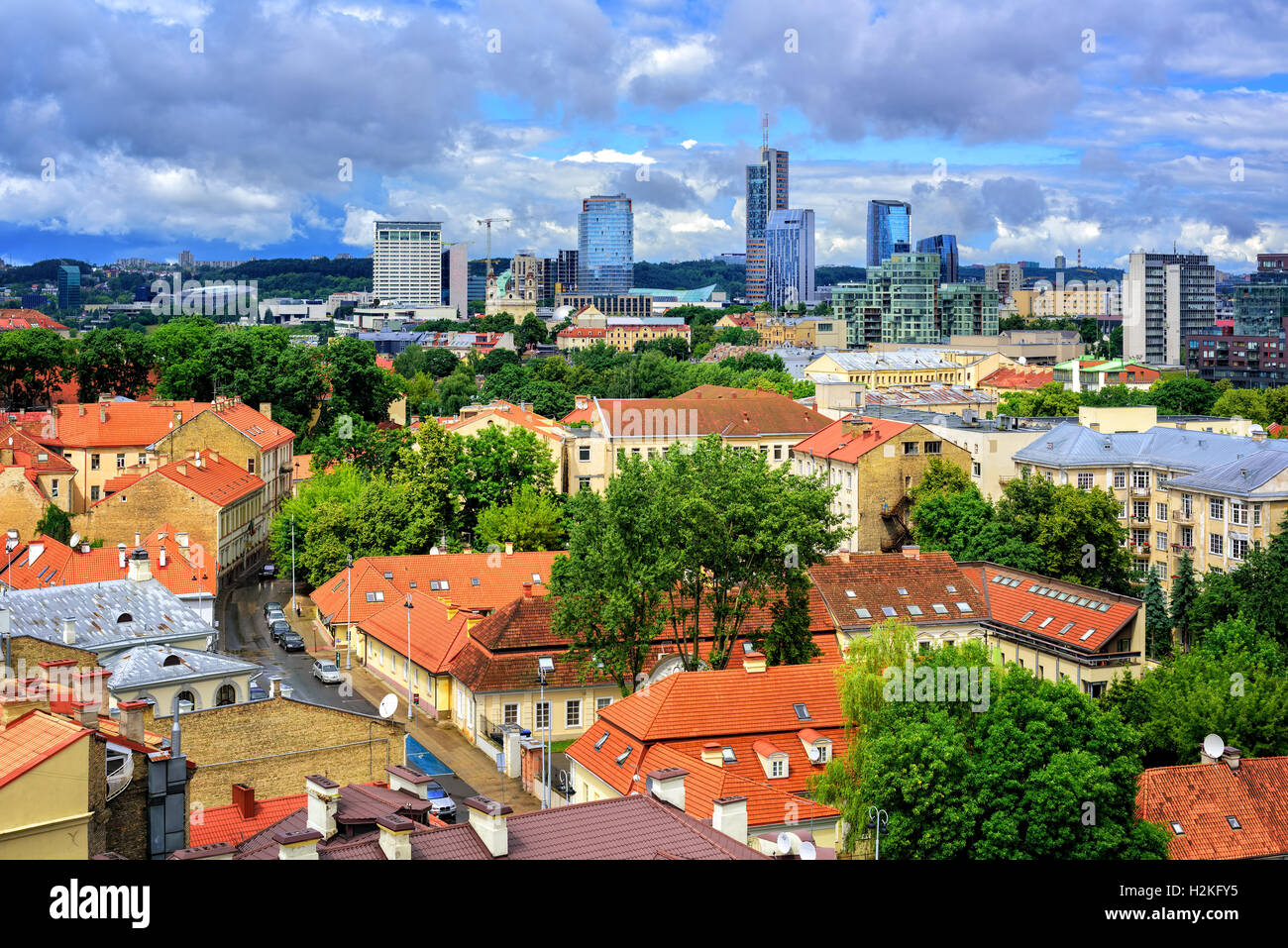 View over the red tiled roofs of the old town of Vilnius to the modern ...