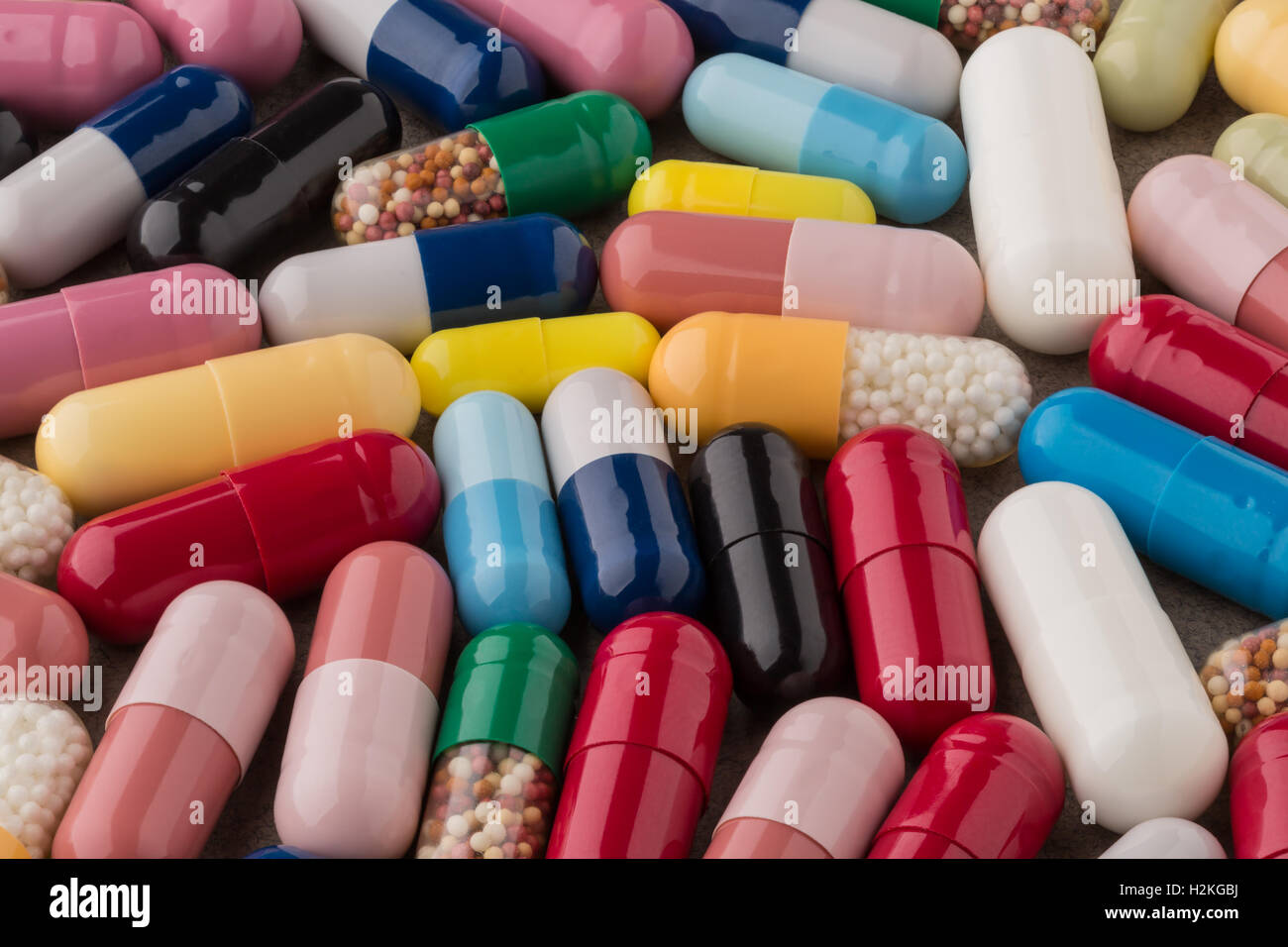 Various colorful medical pills and capsules closeup Stock Photo - Alamy