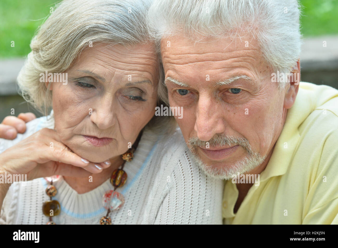 Sad senior couple Stock Photo - Alamy