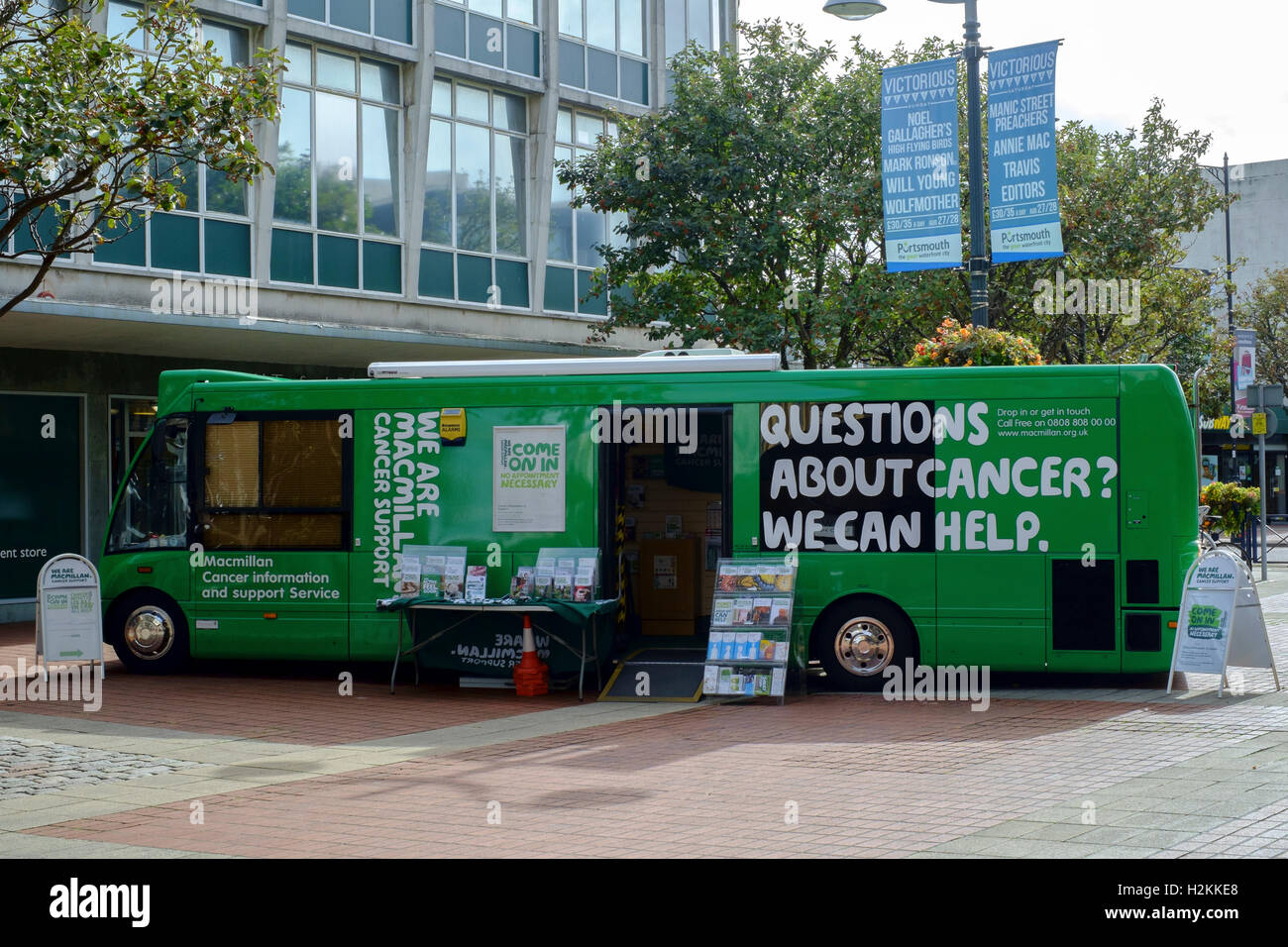 green macmillan cancer charity bus being used as a mobile information ...