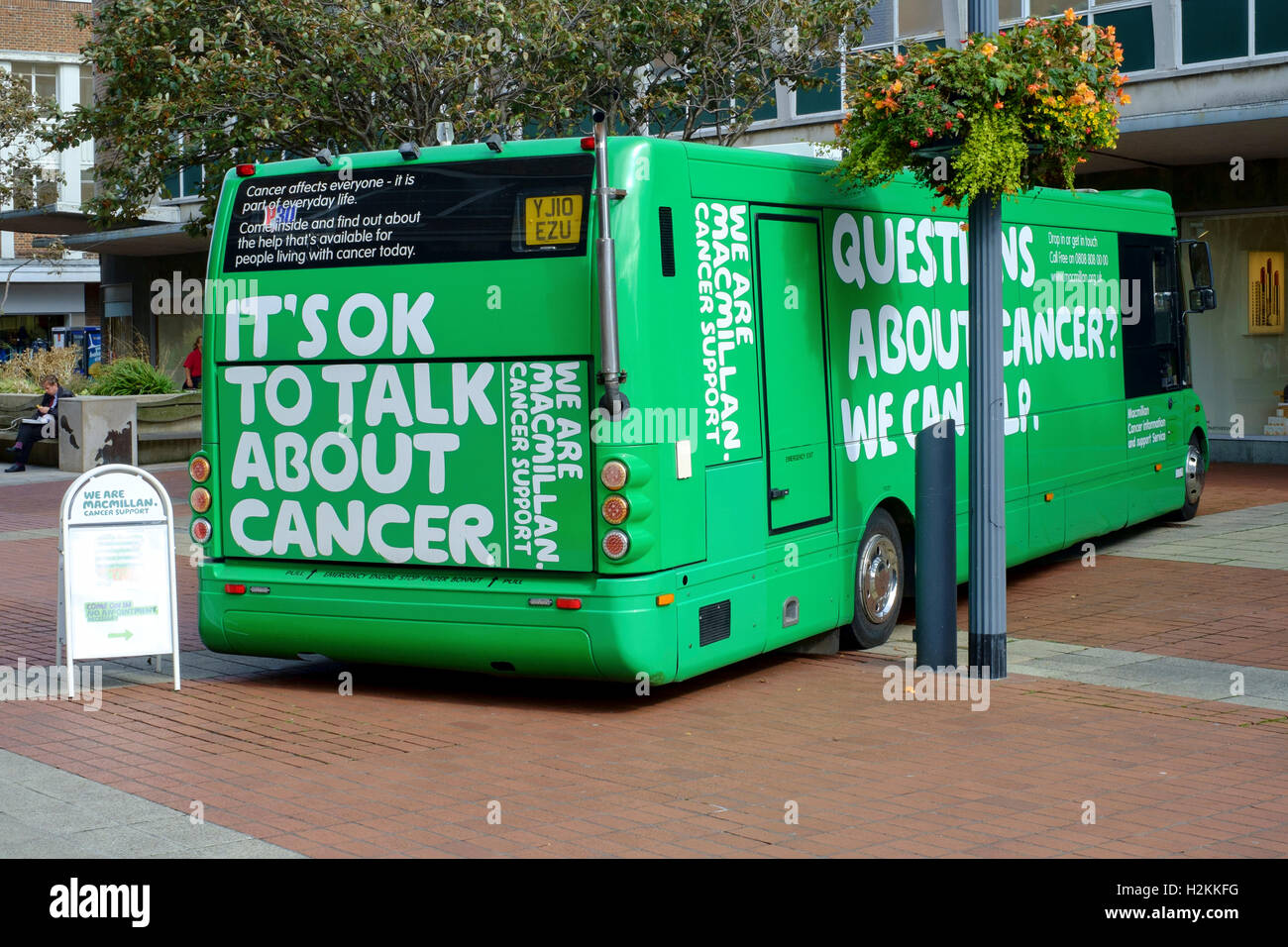 green macmillan cancer charity bus being used as a mobile information ...